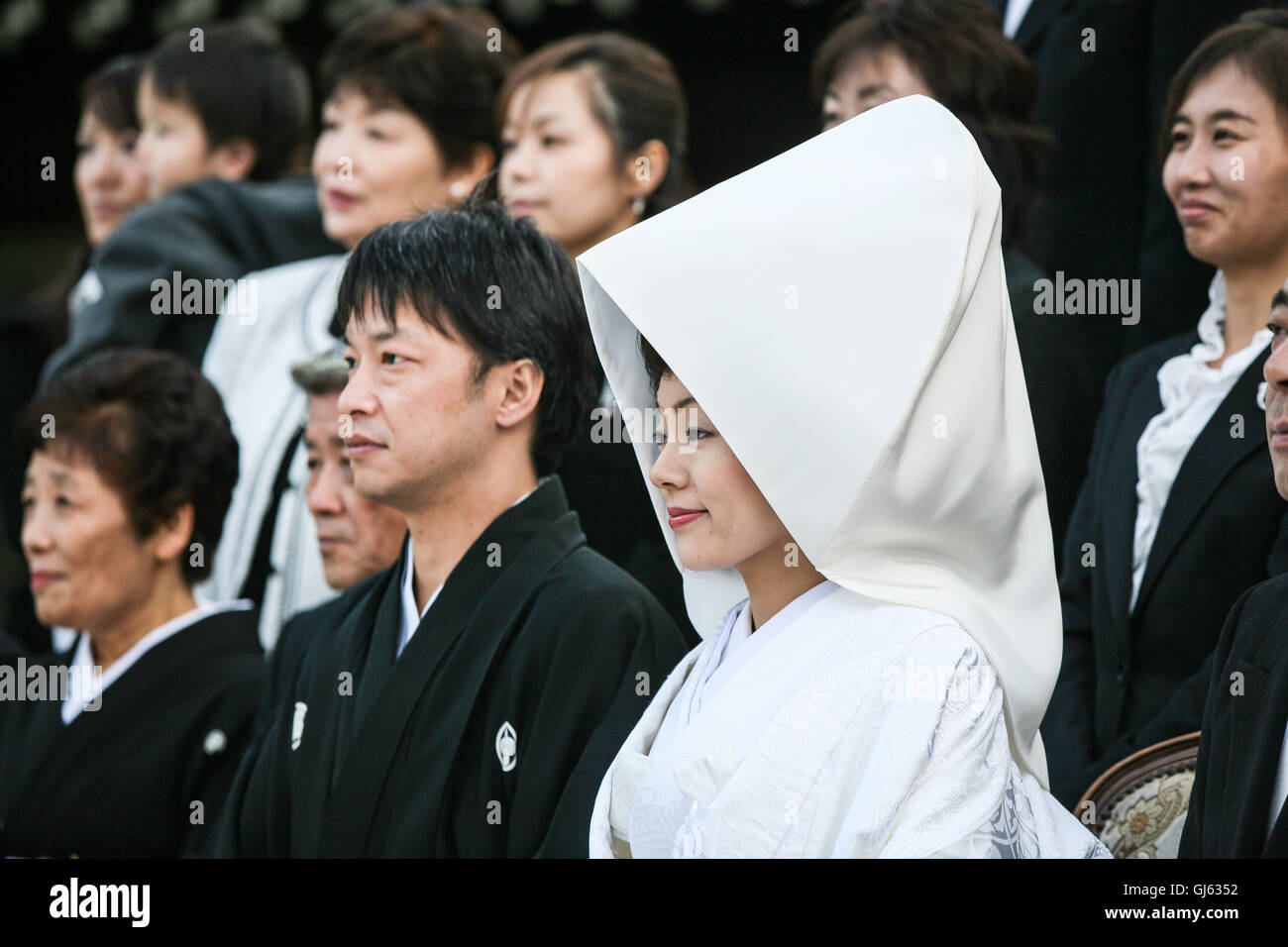 At a traditional Japanese Shinto wedding ceremony, the bride and groom ...