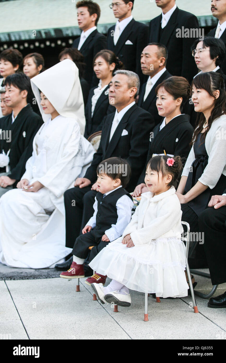 At a traditional Japanese Shinto wedding ceremony, the bride and groom ...