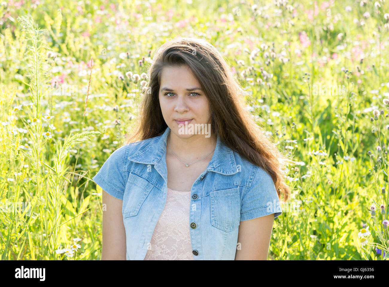 15 year girl with long brown hair on summer glade Stock Photo - Alamy