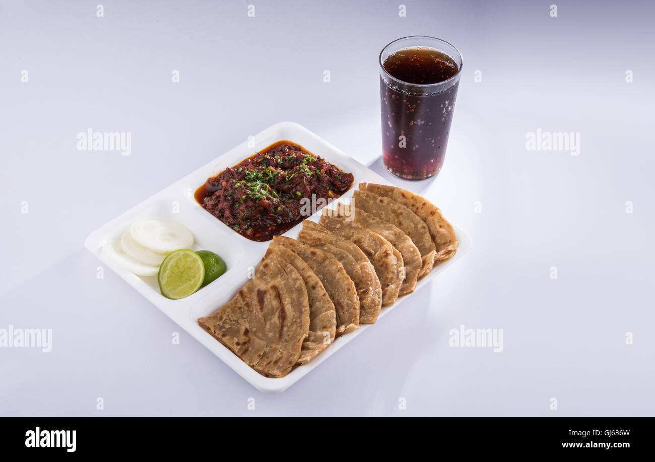 Indian lamb korma curry and indian bread or roti, with cold drink ...