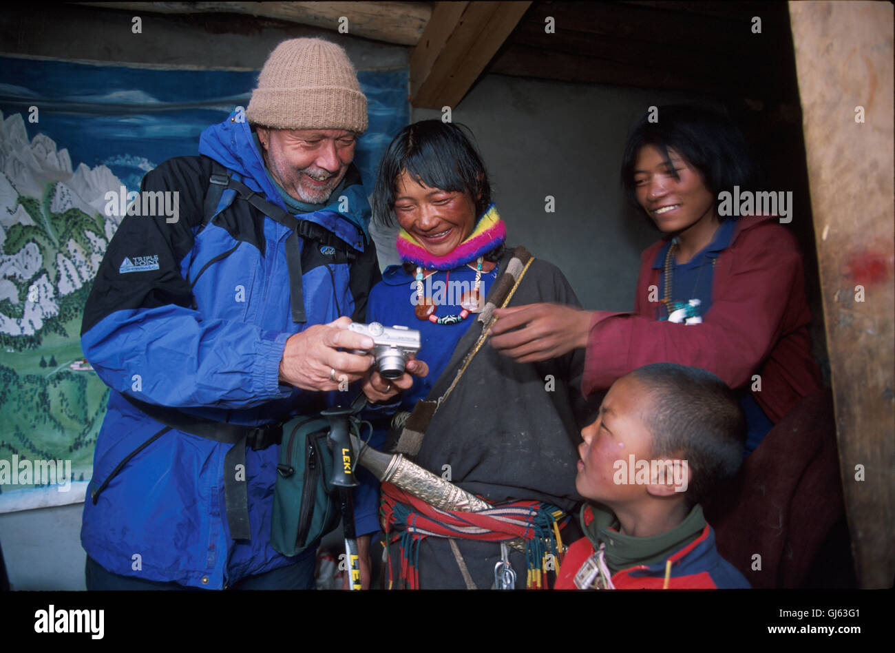 Our expedition group leader shows the photographs he has just taken on ...