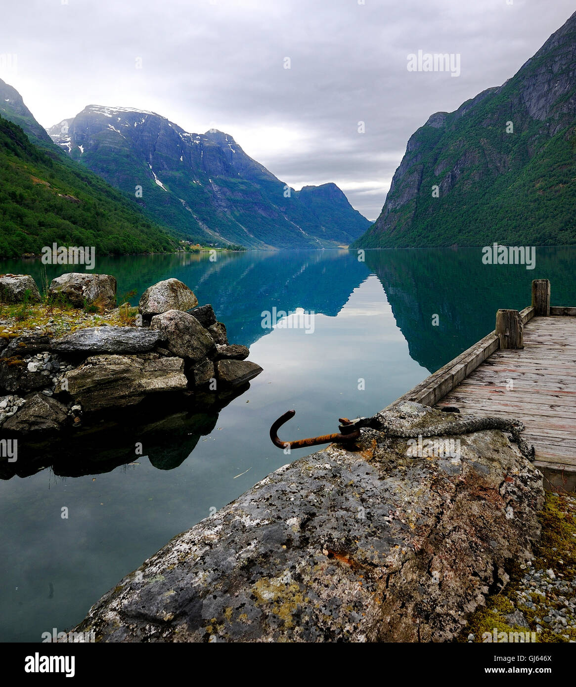 Rusty hook on the jetty Stock Photo - Alamy