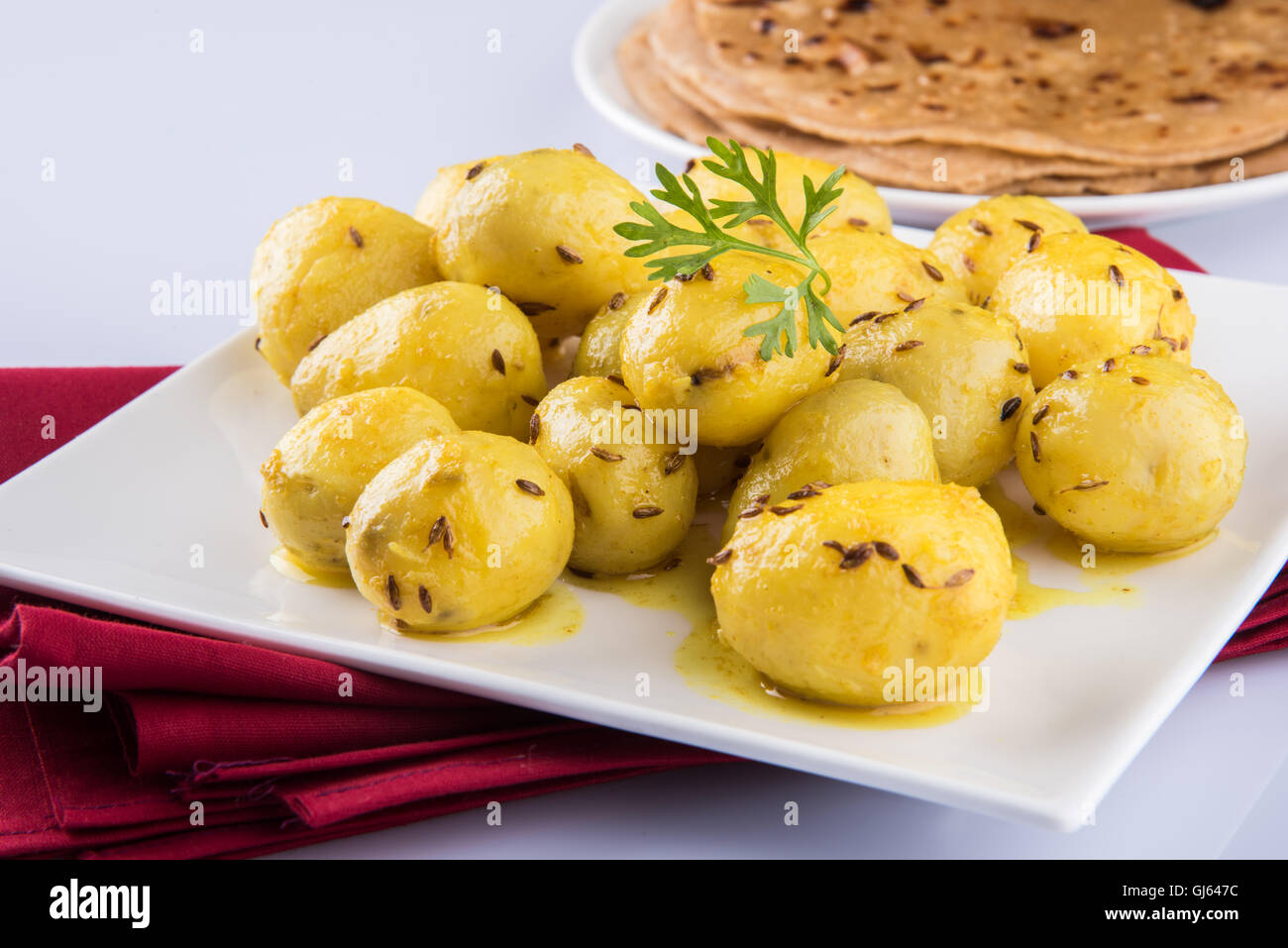 dry potato curry or potato bhaji or aalu bhaji and chapati or paratha ...