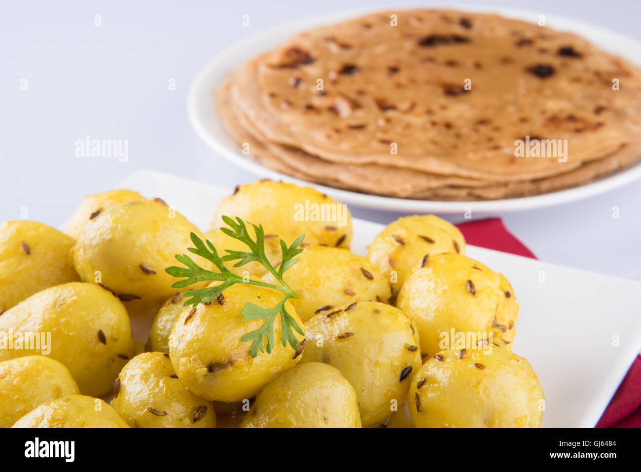 dry potato curry or potato bhaji or aalu bhaji and chapati or paratha ...