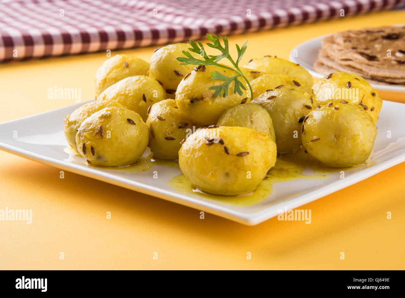 aloo fry or dry potato curry with chapati or roti or indian bread Stock ...