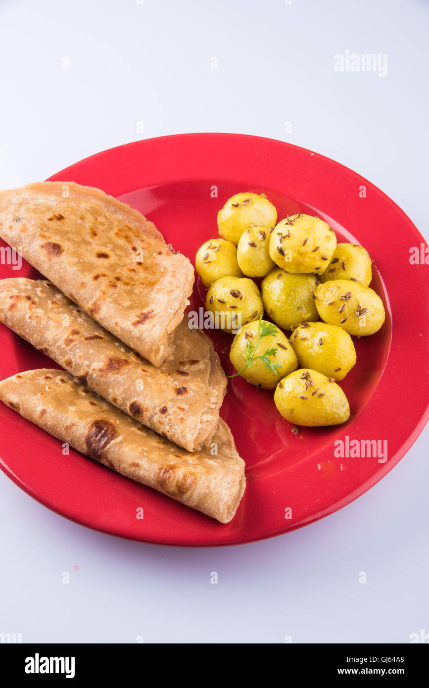 aloo fry or dry potato curry with chapati or roti or indian bread Stock ...