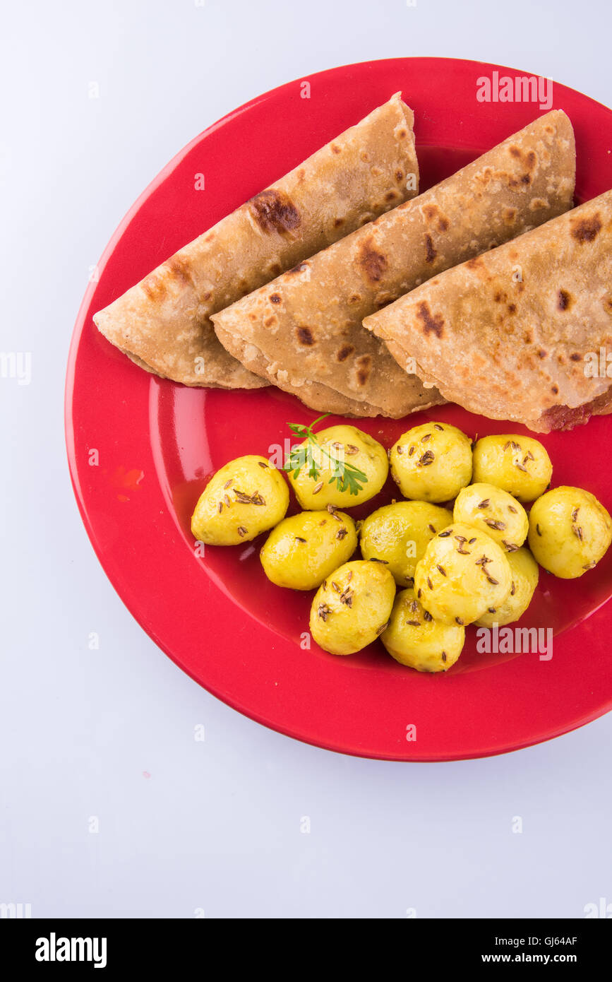 aloo fry or dry potato curry with chapati or roti or indian bread Stock ...
