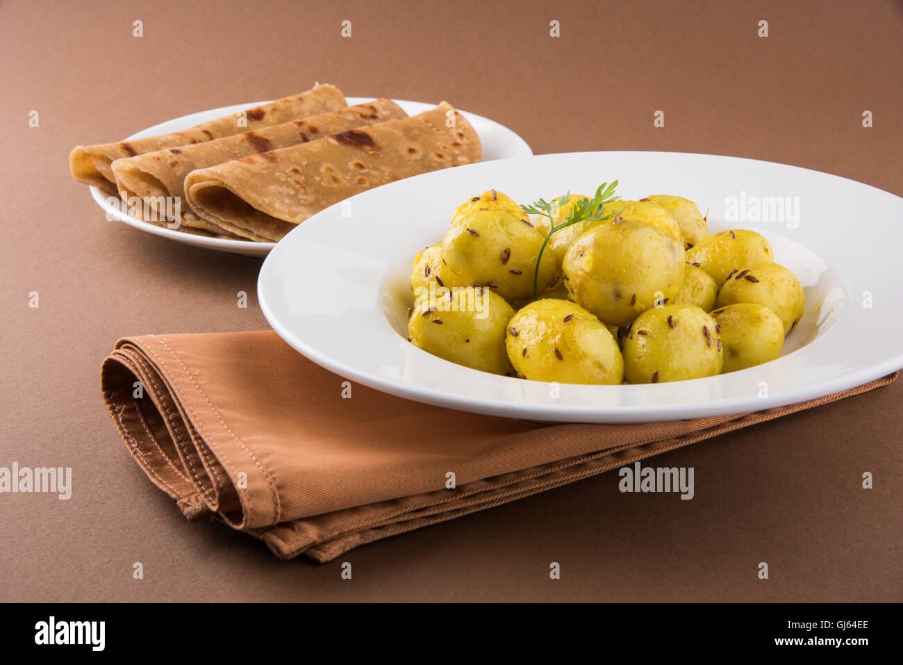 dry potato curry or potato bhaji or aalu bhaji and chapati or paratha ...