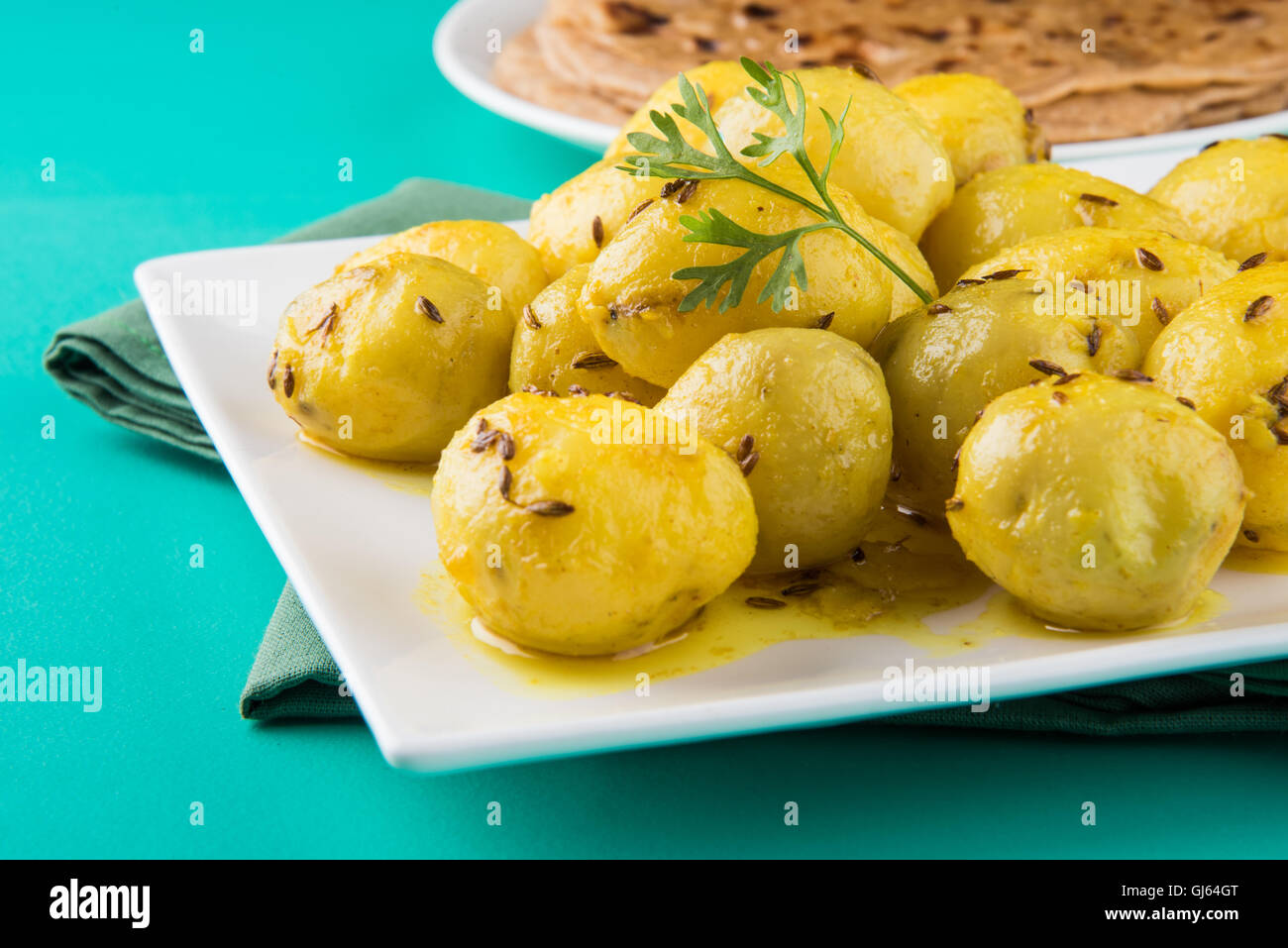 dry potato curry or potato bhaji or aalu bhaji and chapati or paratha ...