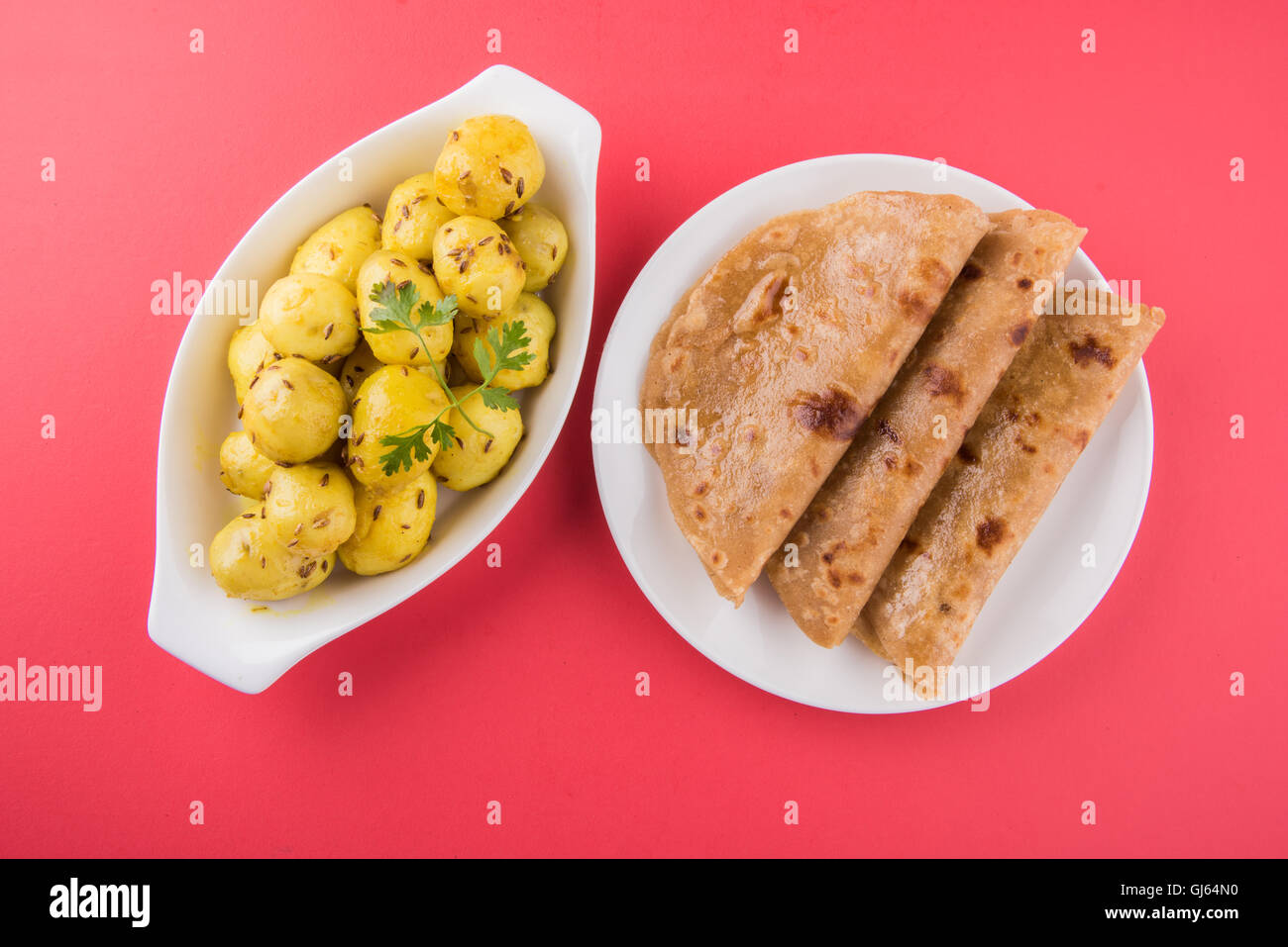 dry potato curry or potato bhaji or aalu bhaji and chapati or paratha ...