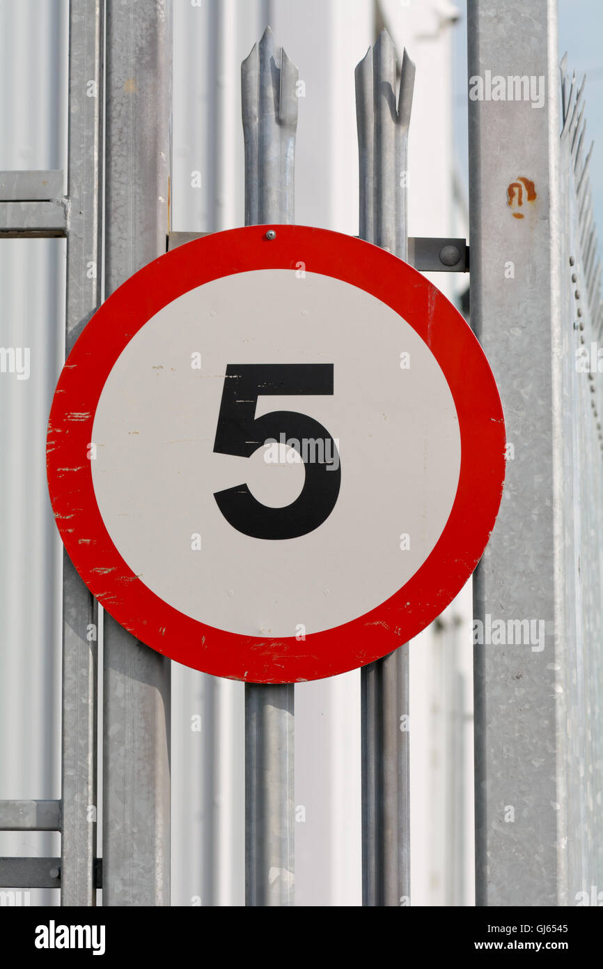 5 mph sign on fence Stock Photo - Alamy