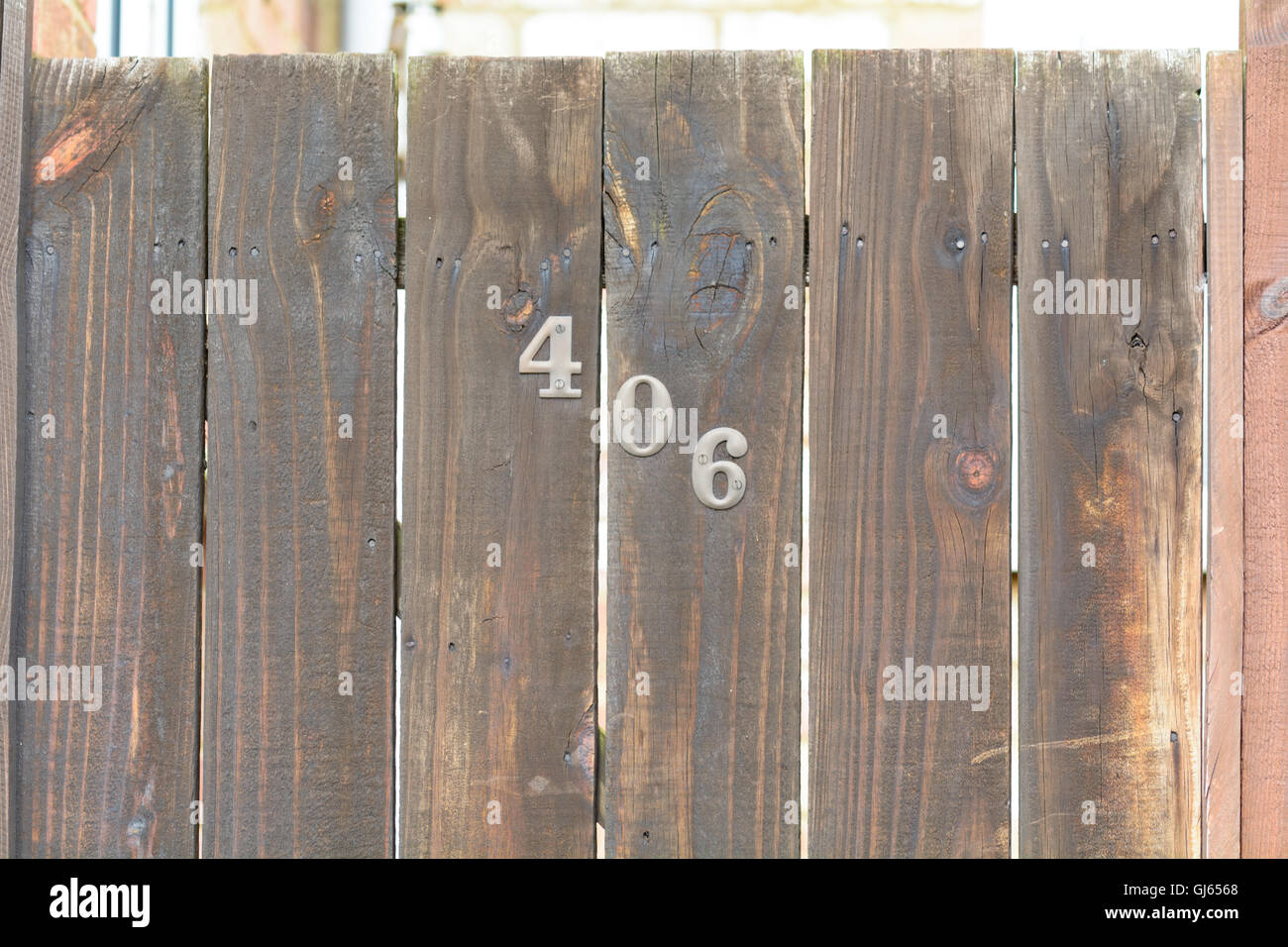 House number 406 sign on fence Stock Photo - Alamy