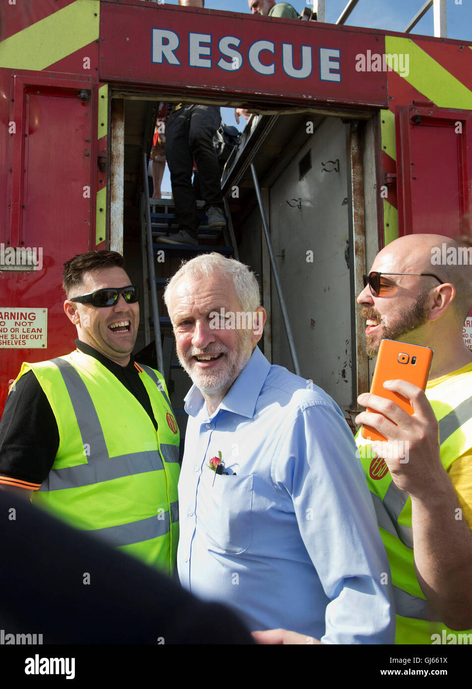 Jeremy Corbyn steps off the back of a fire engine after speaking at a ...