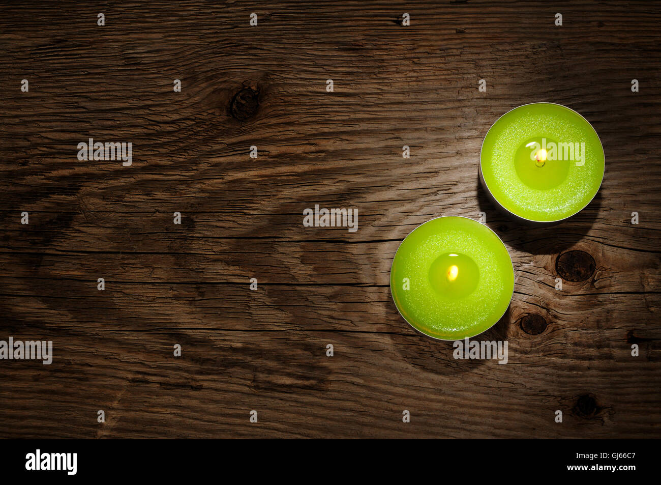 Small candles on wooden background Stock Photo - Alamy