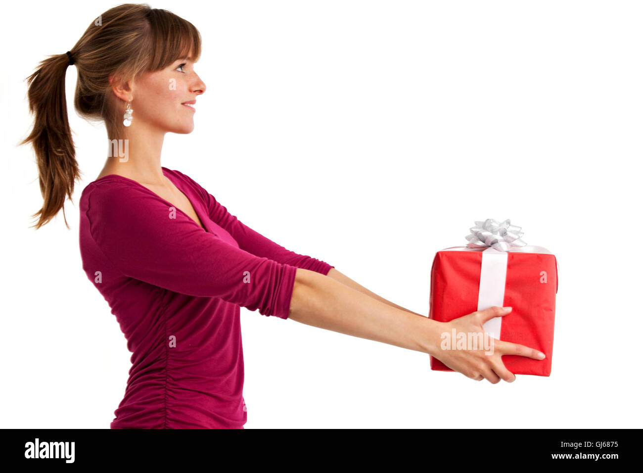 pretty young woman holding a present isolated on white Stock Photo - Alamy