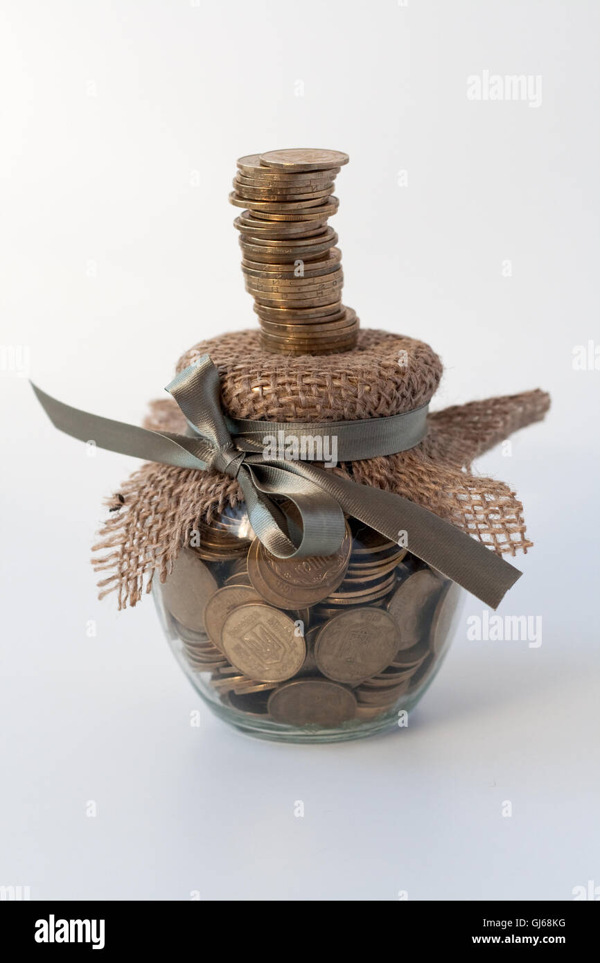 Coins and money bank Stock Photo - Alamy