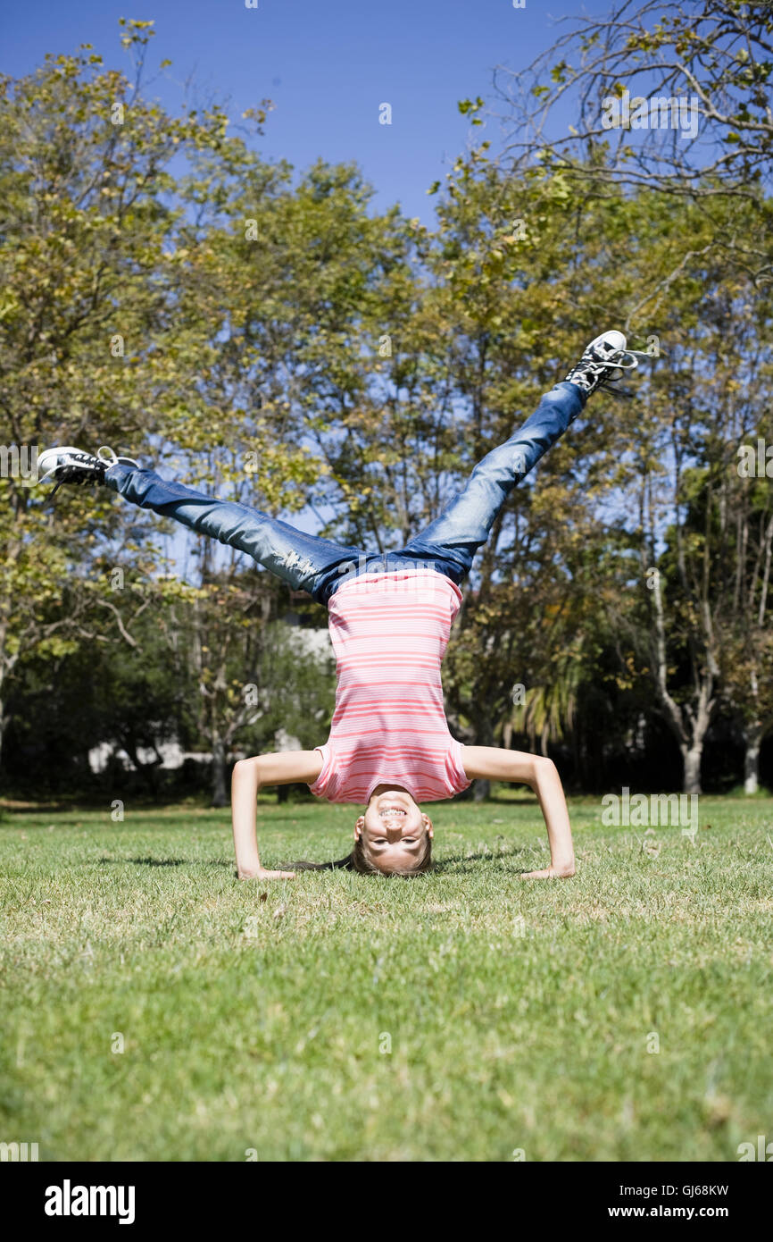Tween Girl doing Headstand Stock Photo - Alamy