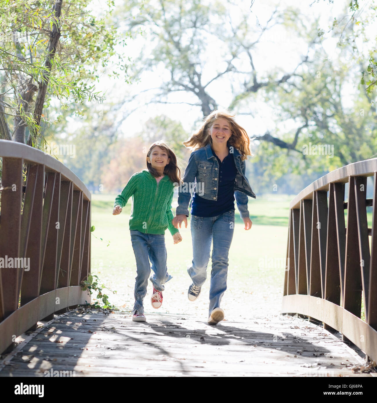 Girls On Bridge Stock Photo - Alamy
