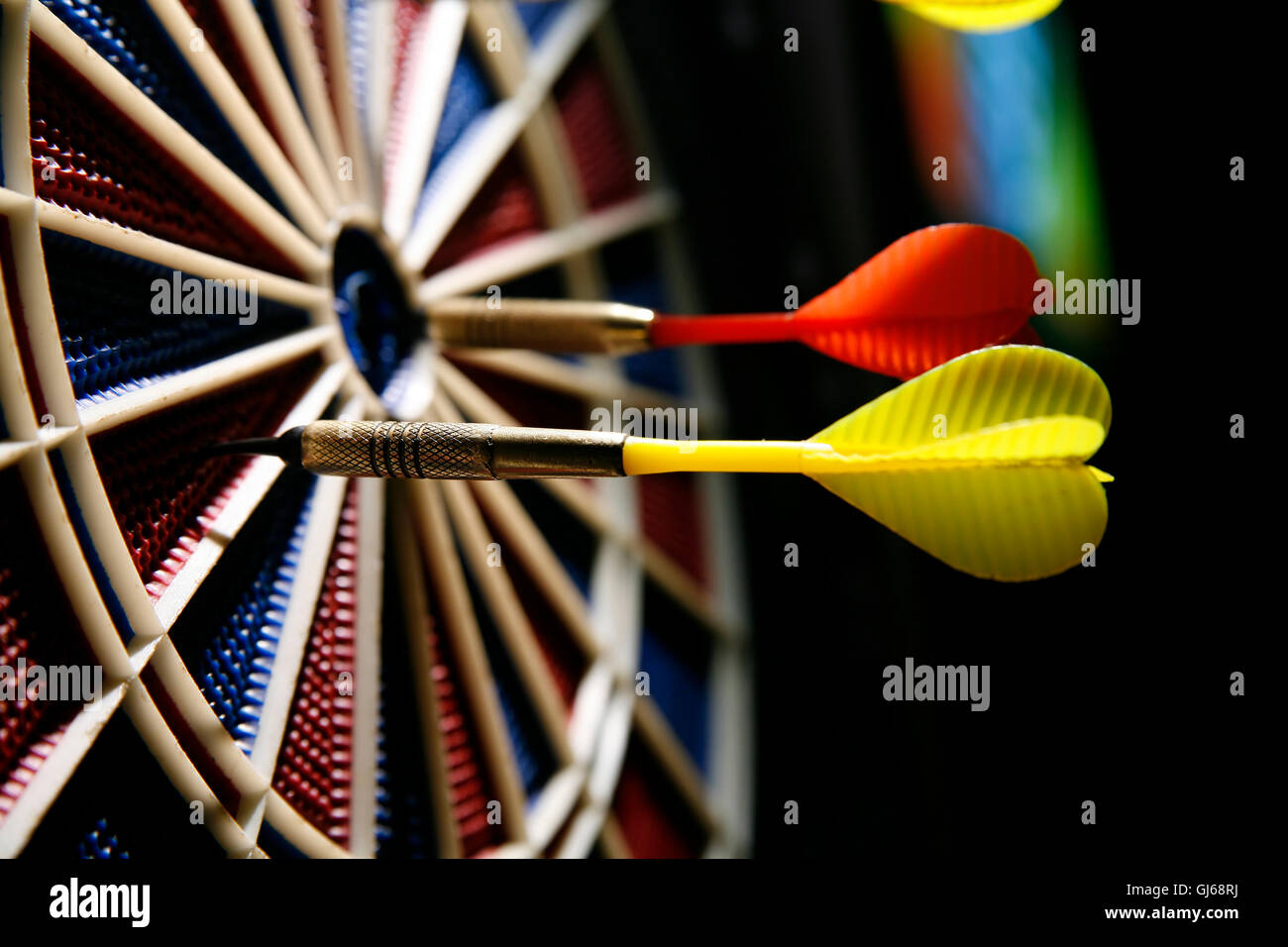 dart board with three darts Stock Photo - Alamy