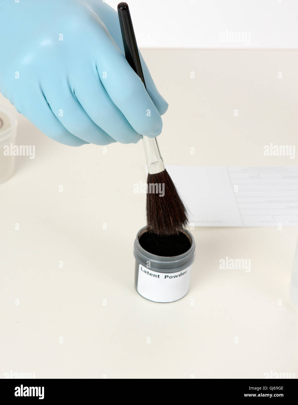 Fingerprint powder and brush Stock Photo - Alamy