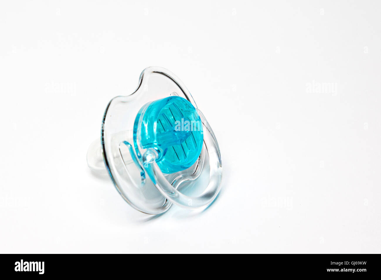 Isolated clear blue pacifier Stock Photo - Alamy