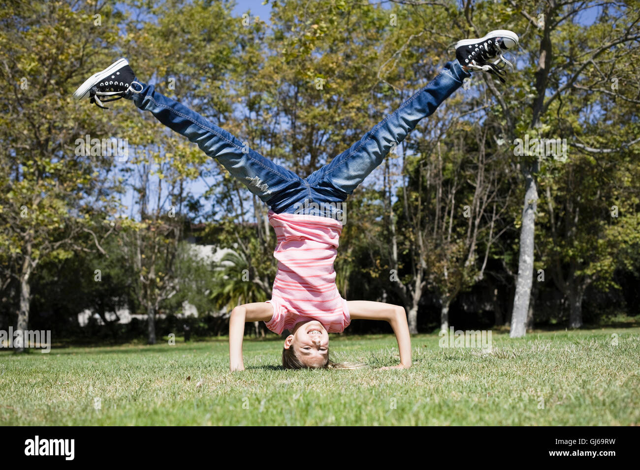 Child doing headstand hi-res stock photography and images - Alamy