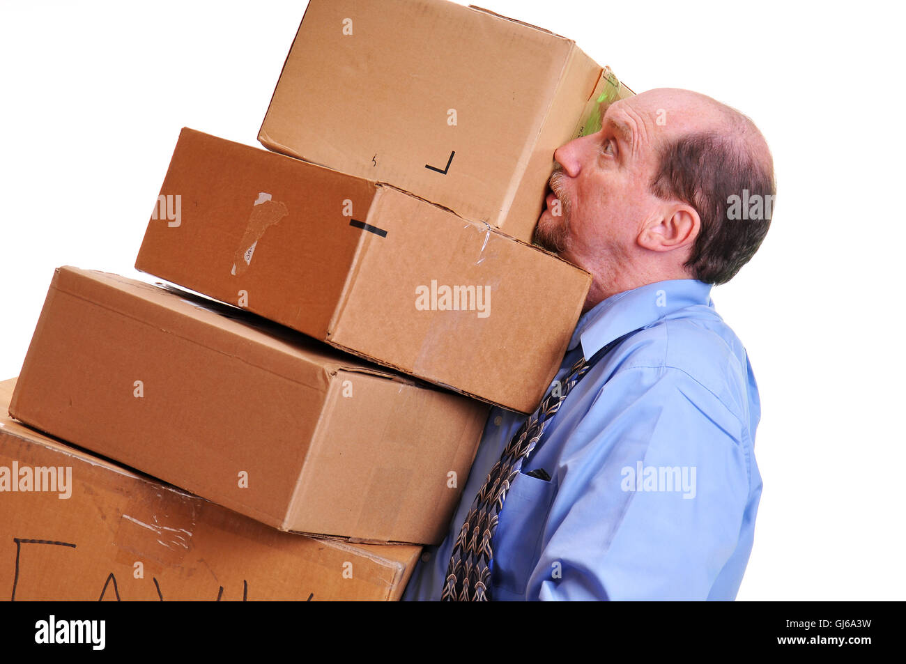 Man carrying heavy boxes Stock Photo - Alamy