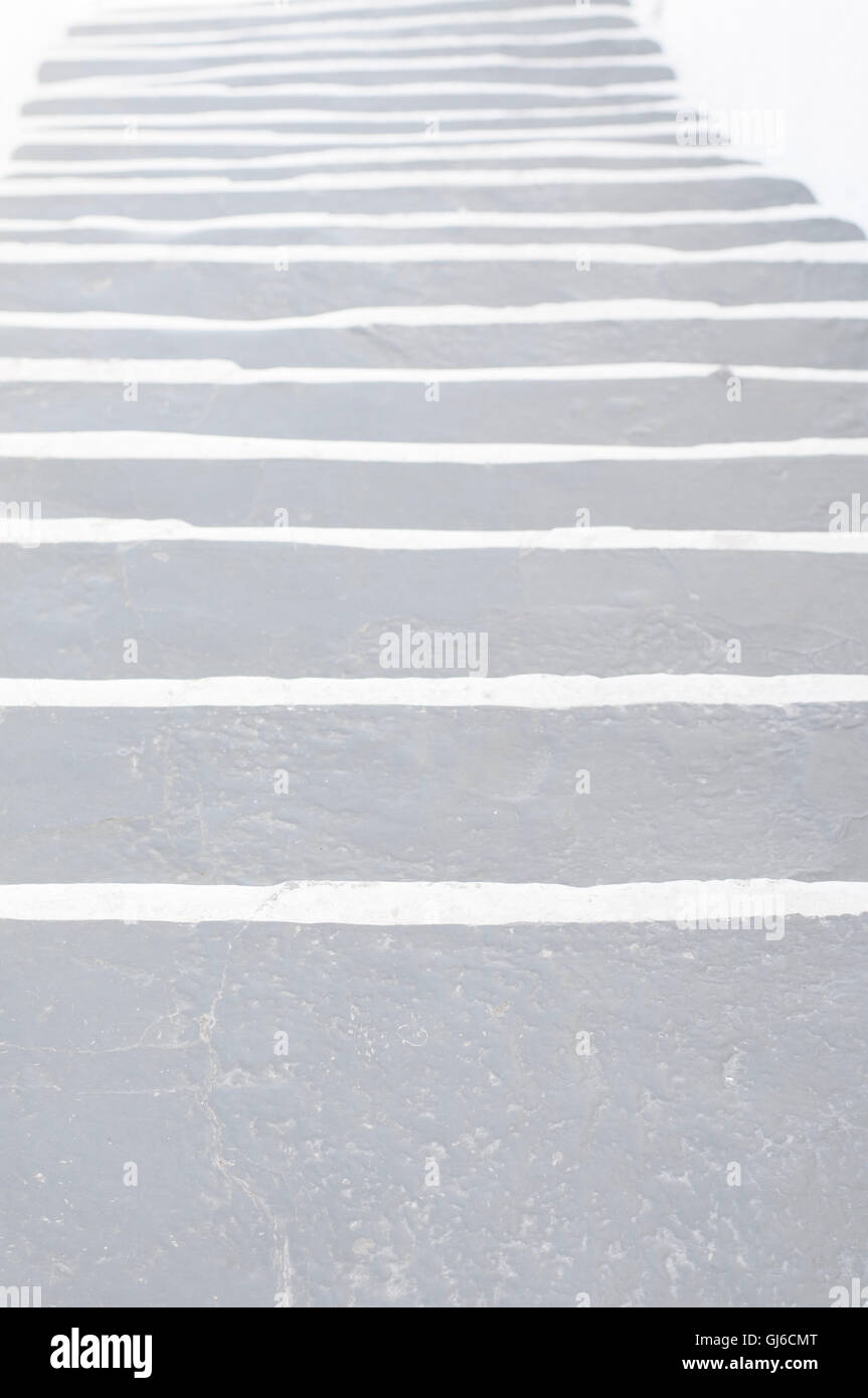 steps downstairs in grey-white Stock Photo - Alamy