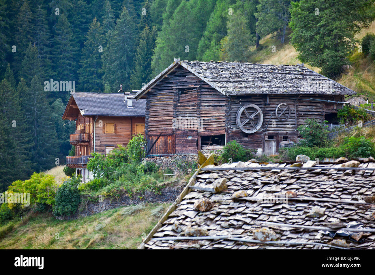 Mountain farm on the steep slope Stock Photo - Alamy