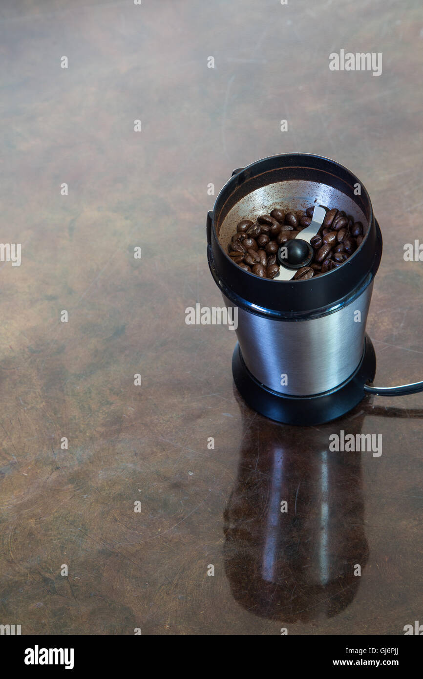 A coffee grinder with beans inside Stock Photo - Alamy
