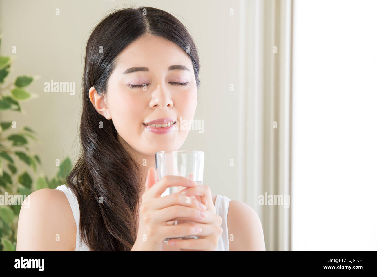 asian woman enjoy the freshness of clean water from perfect environment ...
