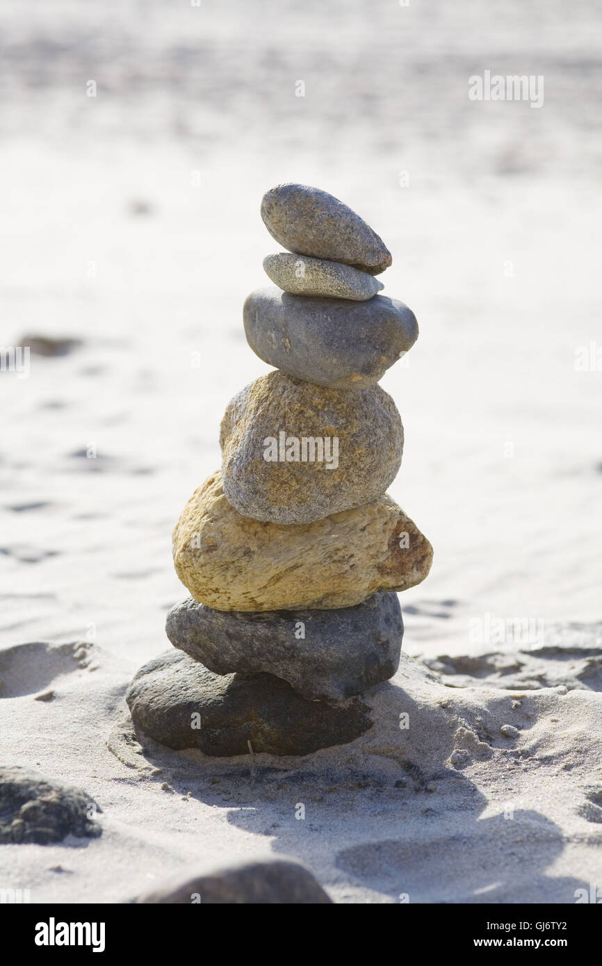 Stacked up stones on the beach Stock Photo - Alamy