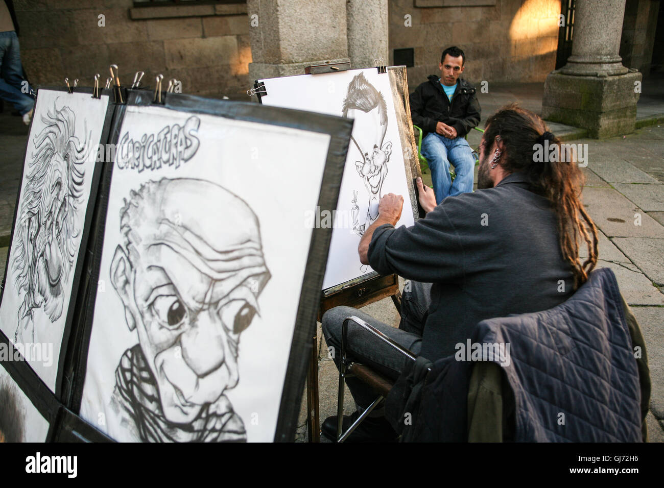 Street caricature artist o the streets of Santiago de Compostela ...