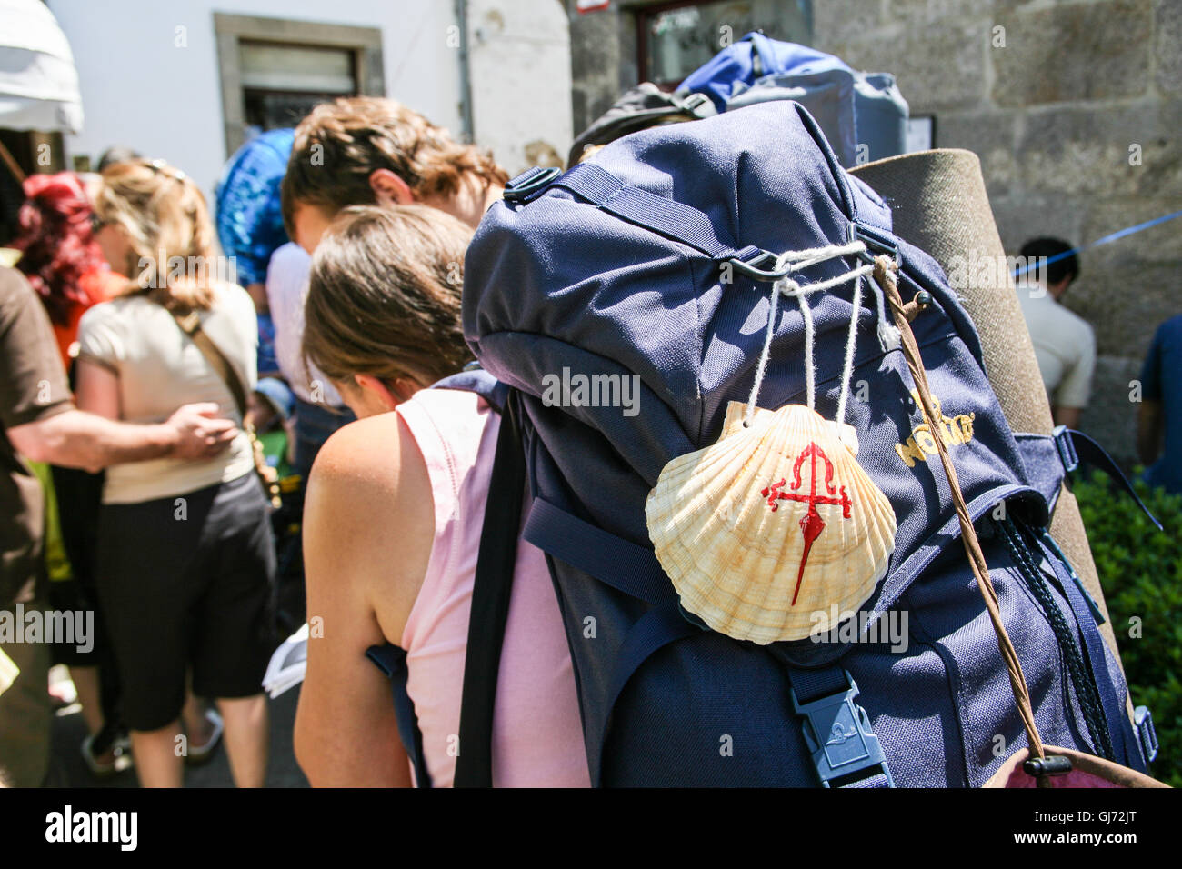 Pilgrims, including one with a, shell, the symbol, of Santiago ...