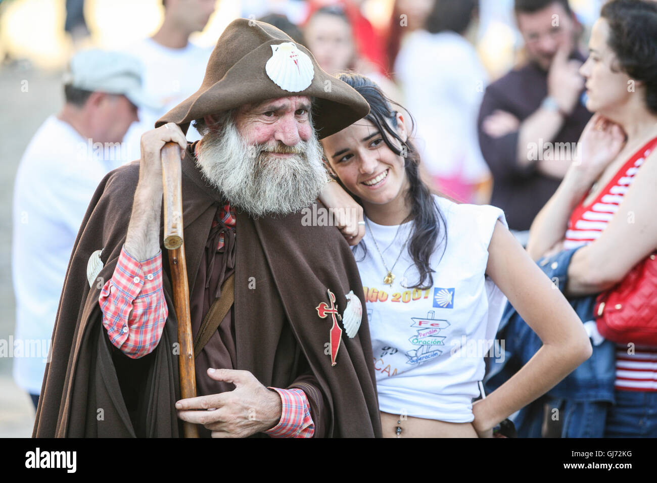 Local guy dressed as a pilgrim poses for a photo with a young Spanish ...