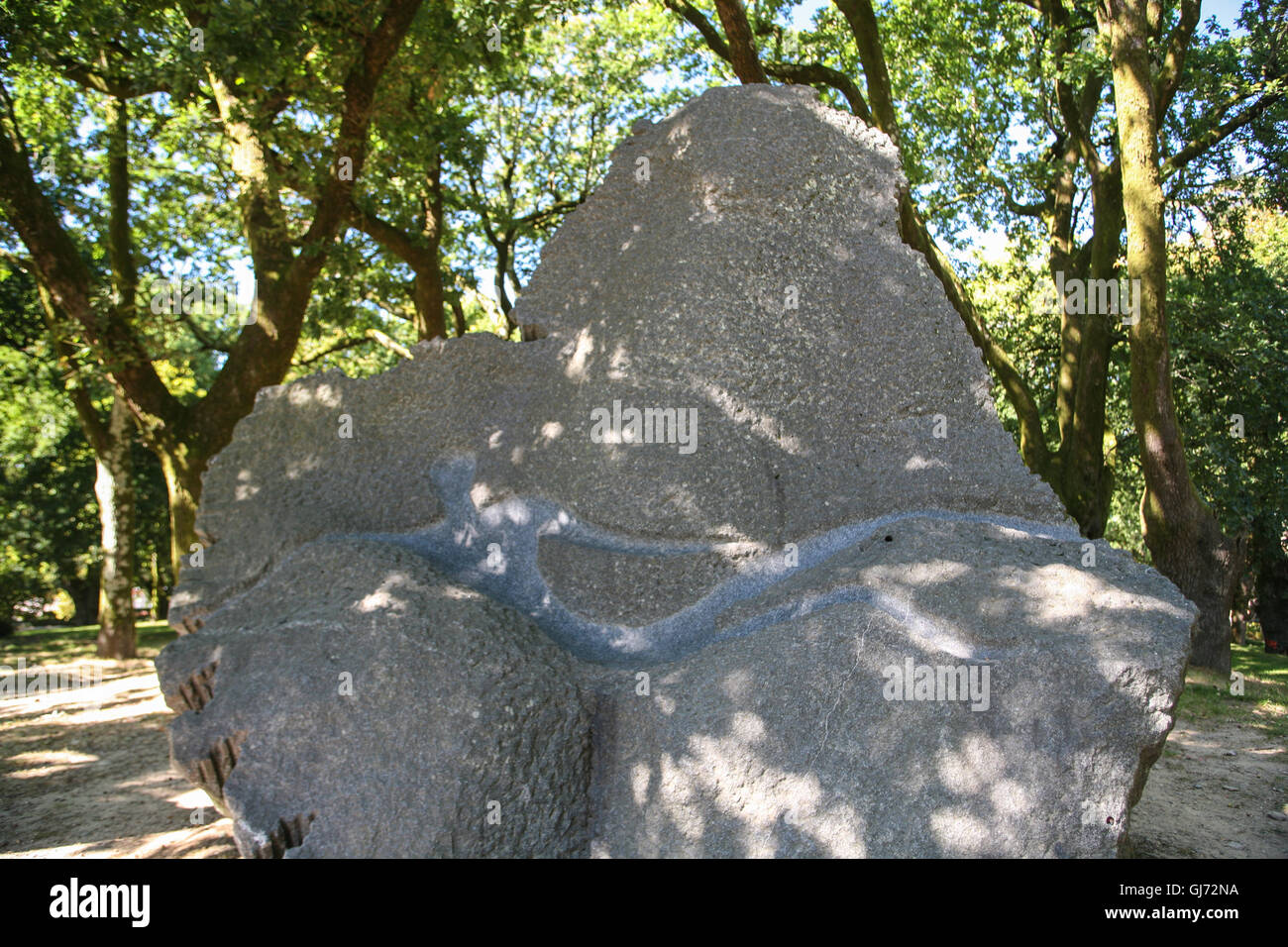 Human form at rest in stone. Stone sculpture in Alameda Park. Central p ...