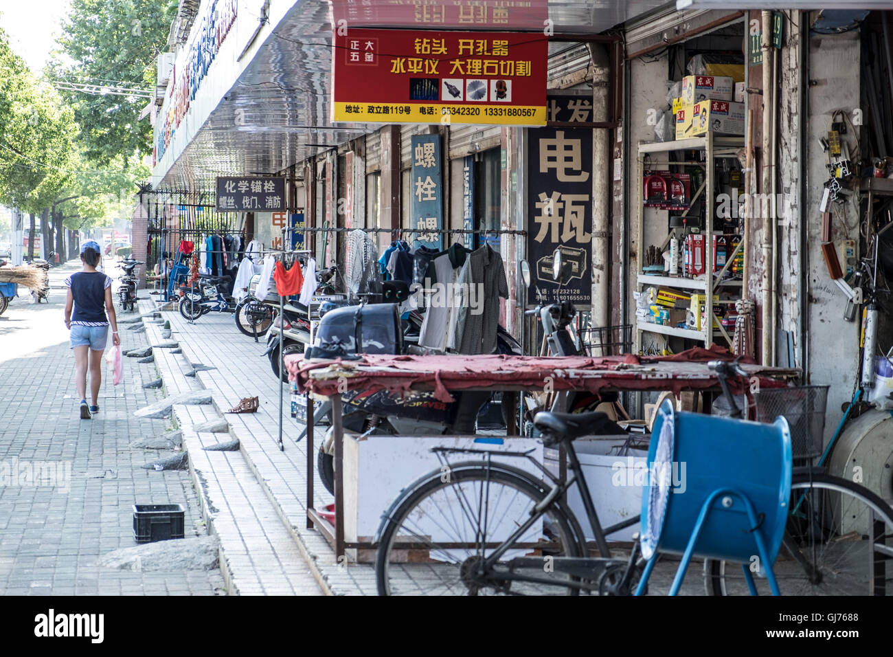 Street scene with small shops and craftsmen Stock Photo - Alamy