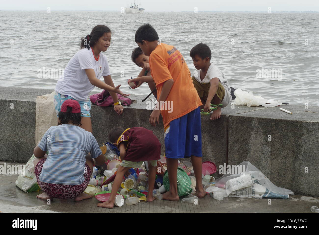 Manila, Philippines. 10th Aug, 2016. A family collects plastics from ...