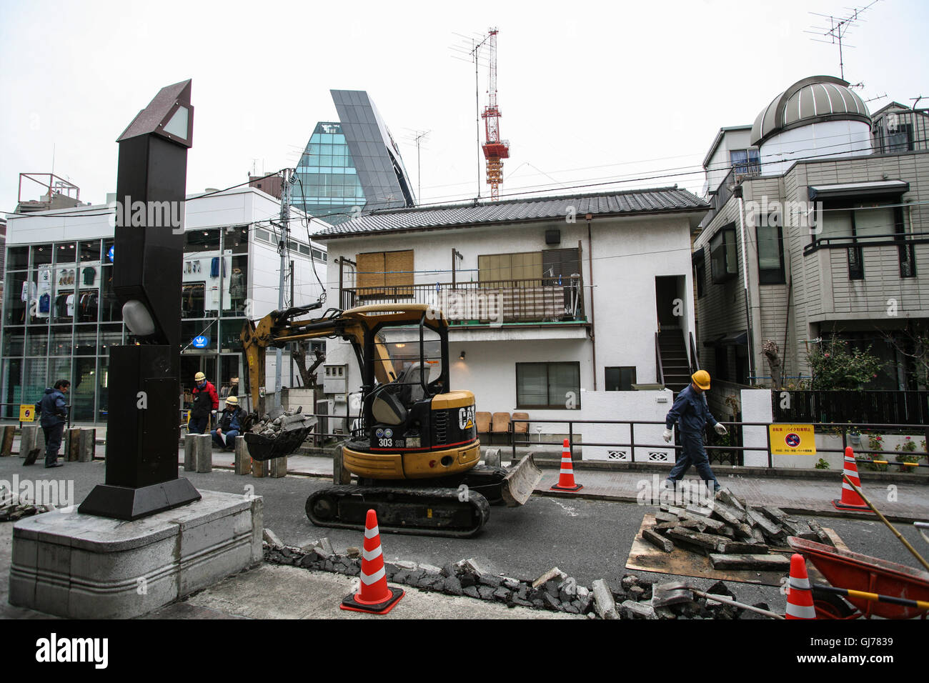 Construction workers on a site redesigning this narrow lane off ...