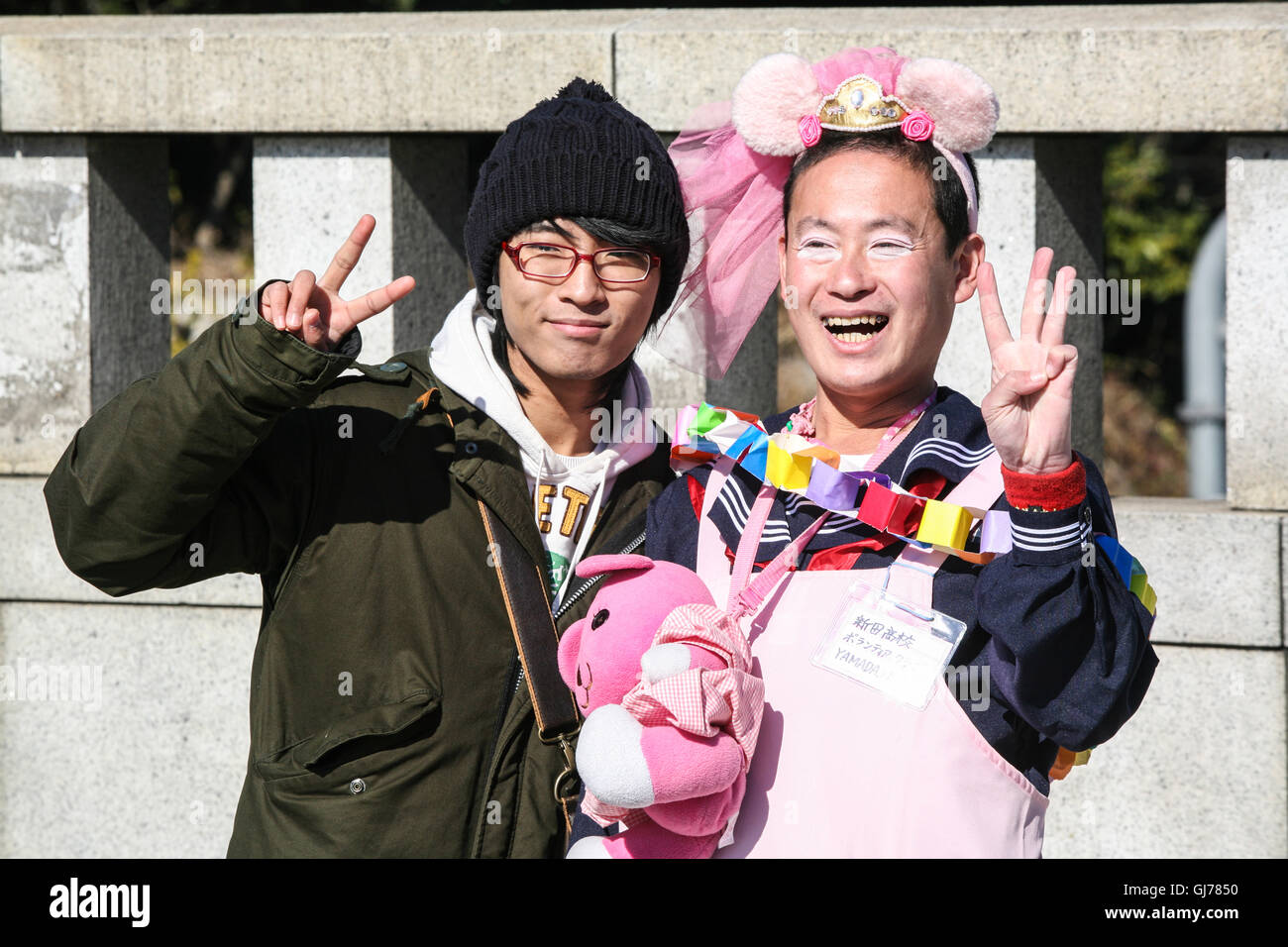 Guy on right in sailor girls uniform offers free hugs to passerbys, and ...
