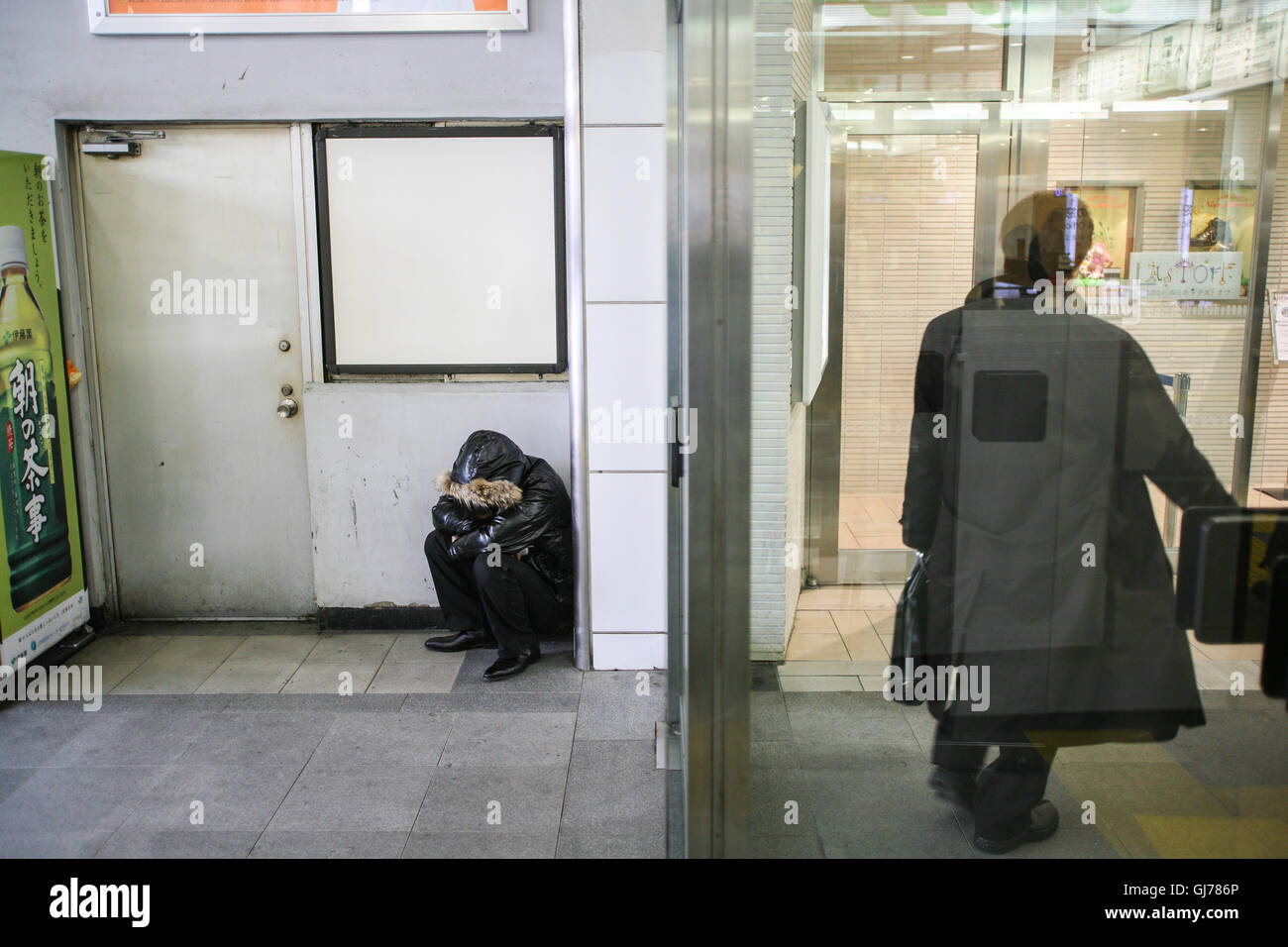 Homeless guy,man,sleeping,lack of,sleep,deprived,on a cold winters day ...