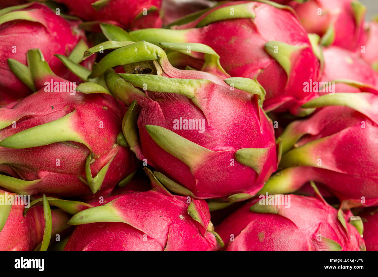 Dragon fruit on market stand, Indonesia Stock Photo - Alamy