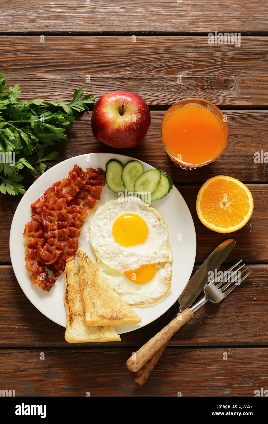 Traditional breakfast - eggs, bacon, toast and vegetables Stock Photo ...