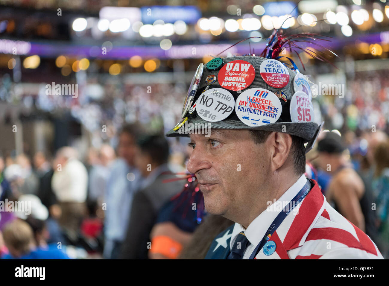 A Democratic delegate from Florida wears a button decorated hat before ...
