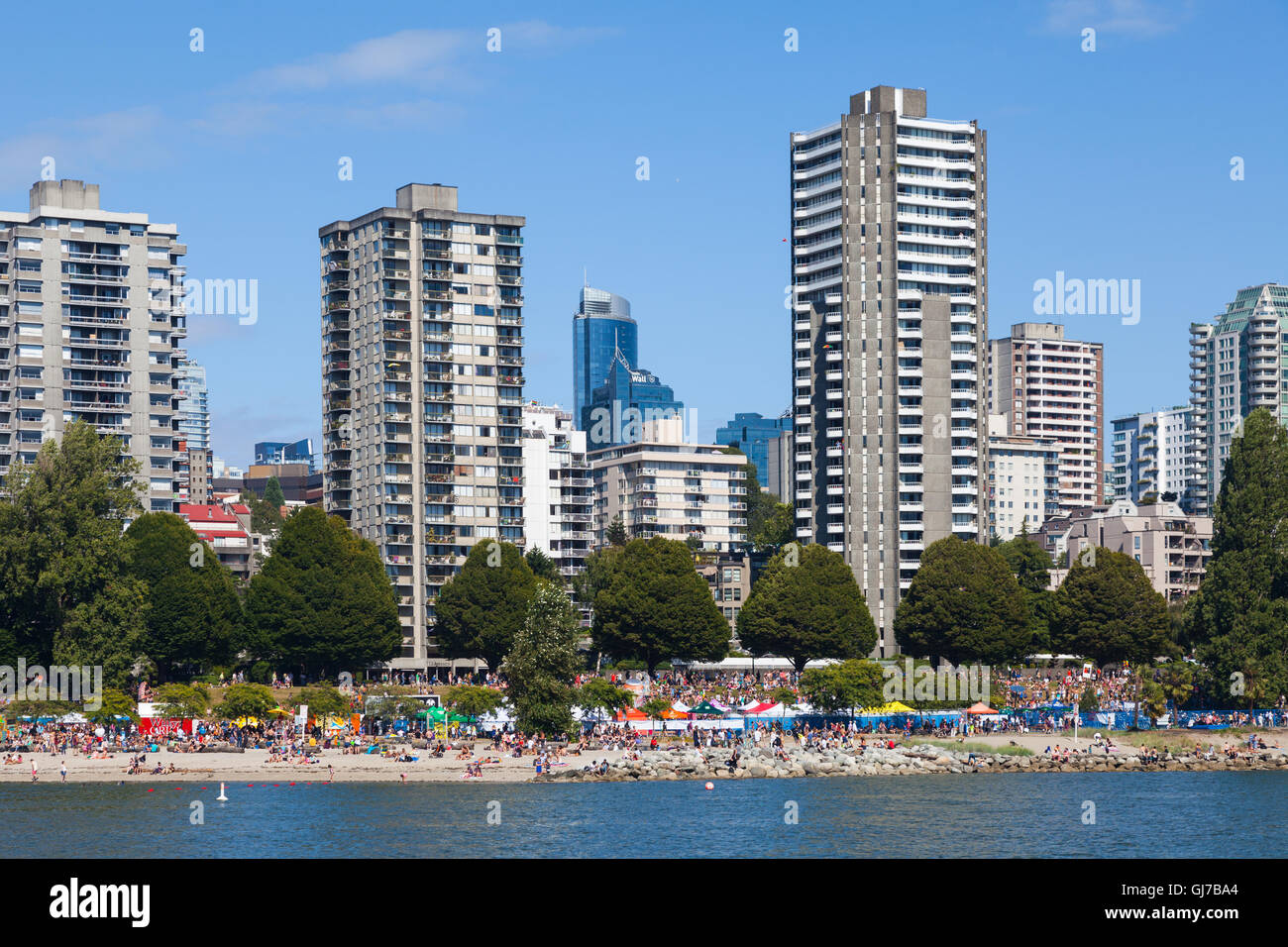 Crowds of people on the beaches of English Bay in the city of Vancouver ...