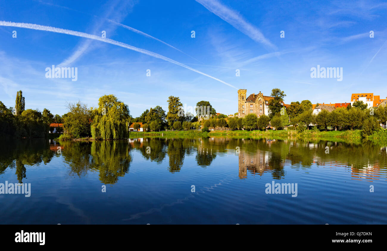 Pond in village with houses reflection in germany Stock Photo - Alamy
