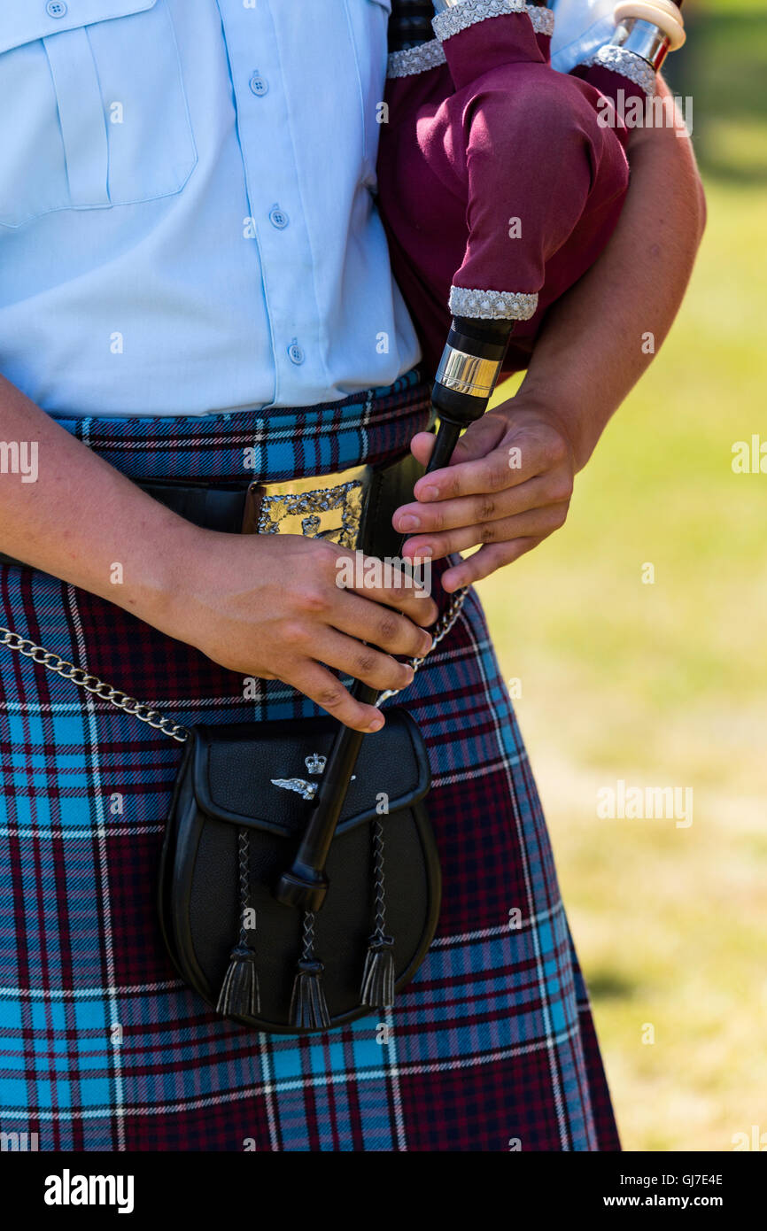 Bagpiper playing pipes at highland games Stock Photo - Alamy