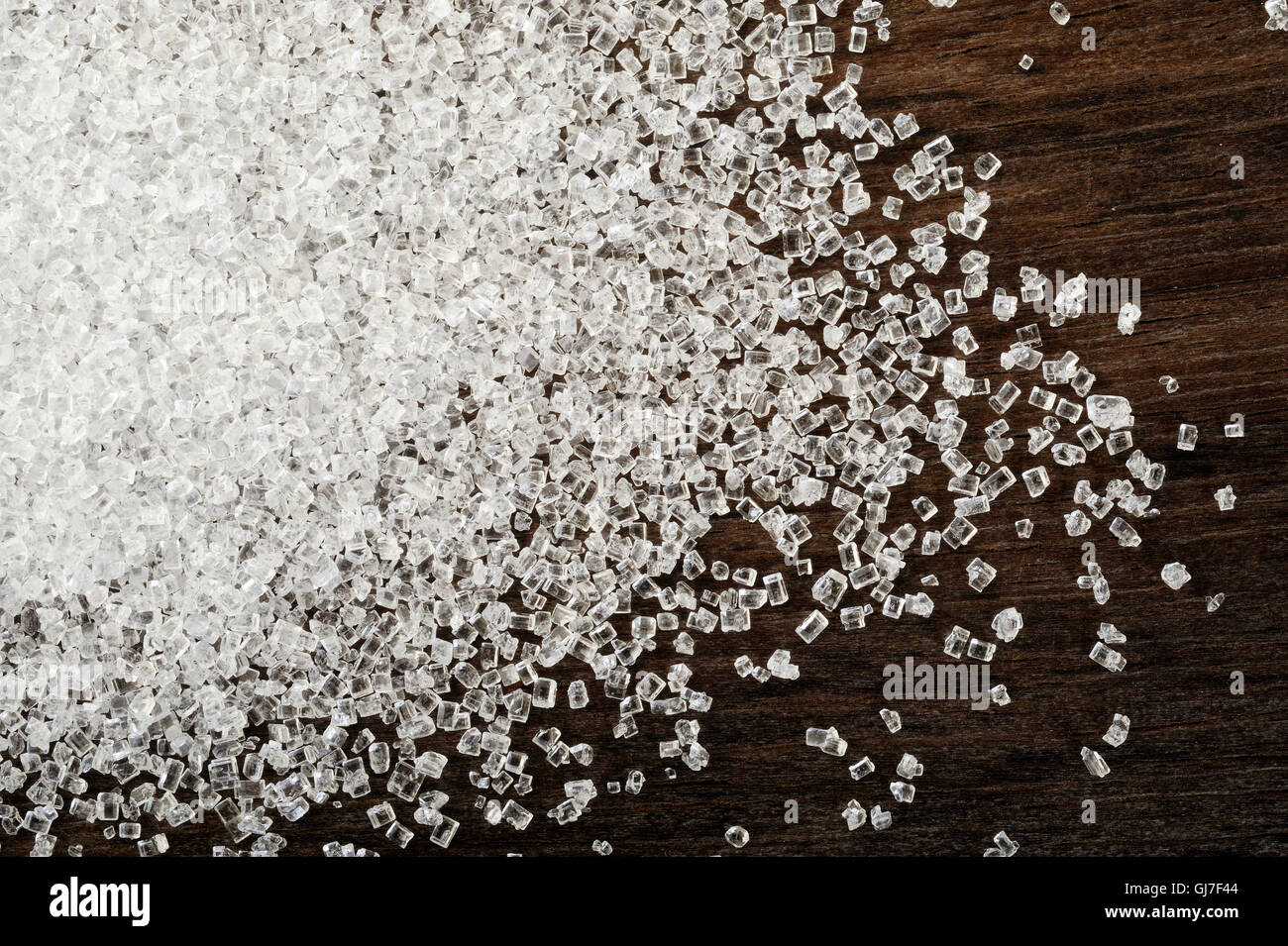 sugar on wooden table background Stock Photo - Alamy