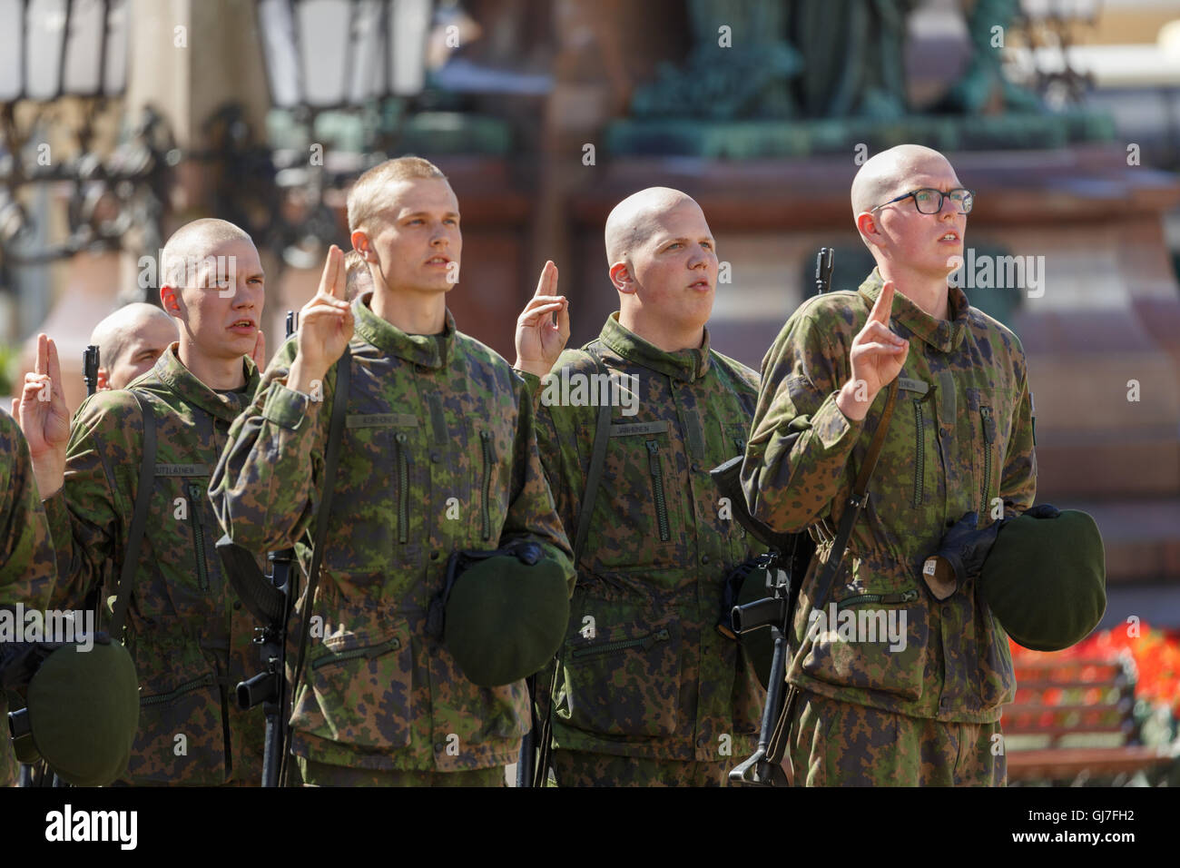 Finnish conscripts bare their heads to give their military oath in ...