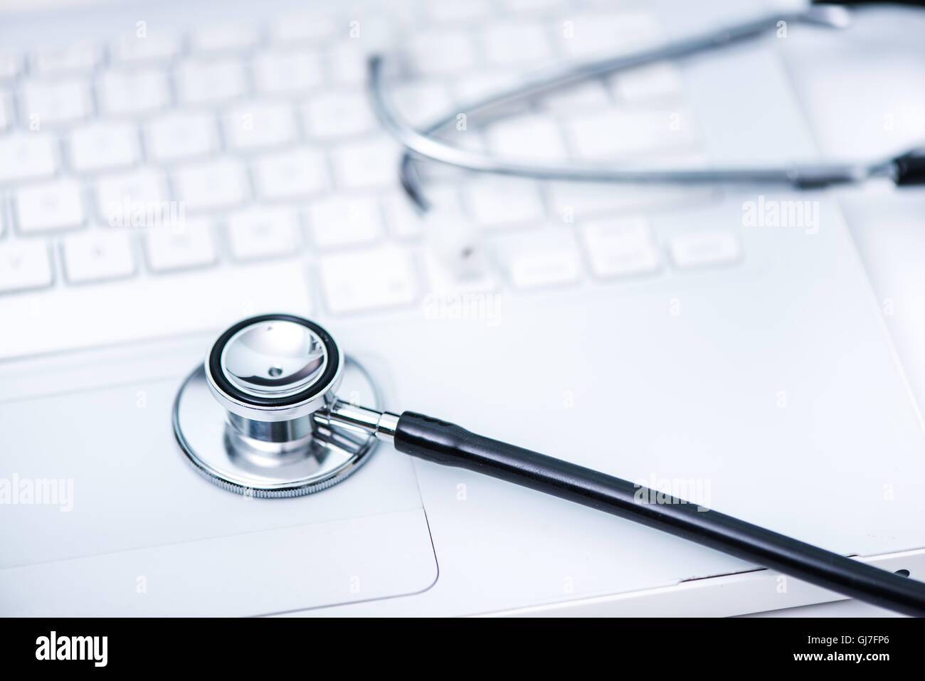 stetoscope on desktop computer keyboard, on line doctor concept Stock ...